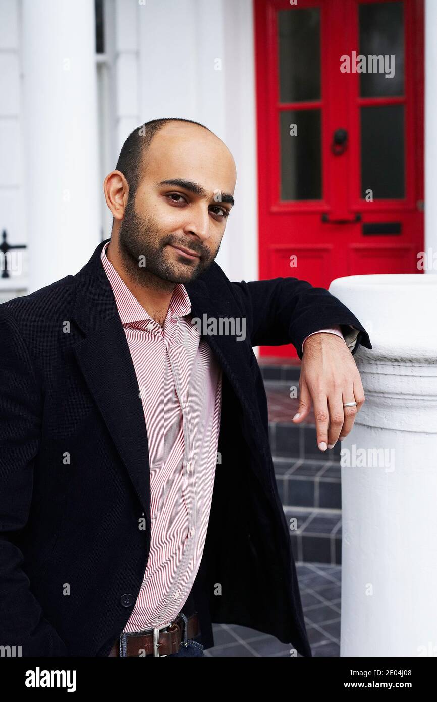 Author Mohsin Hamid poses for photographs in London Stock Photo - Alamy