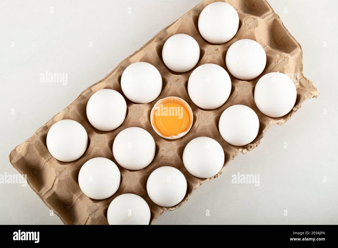 Raw chicken eggs in a carton container Stock Photo - Alamy