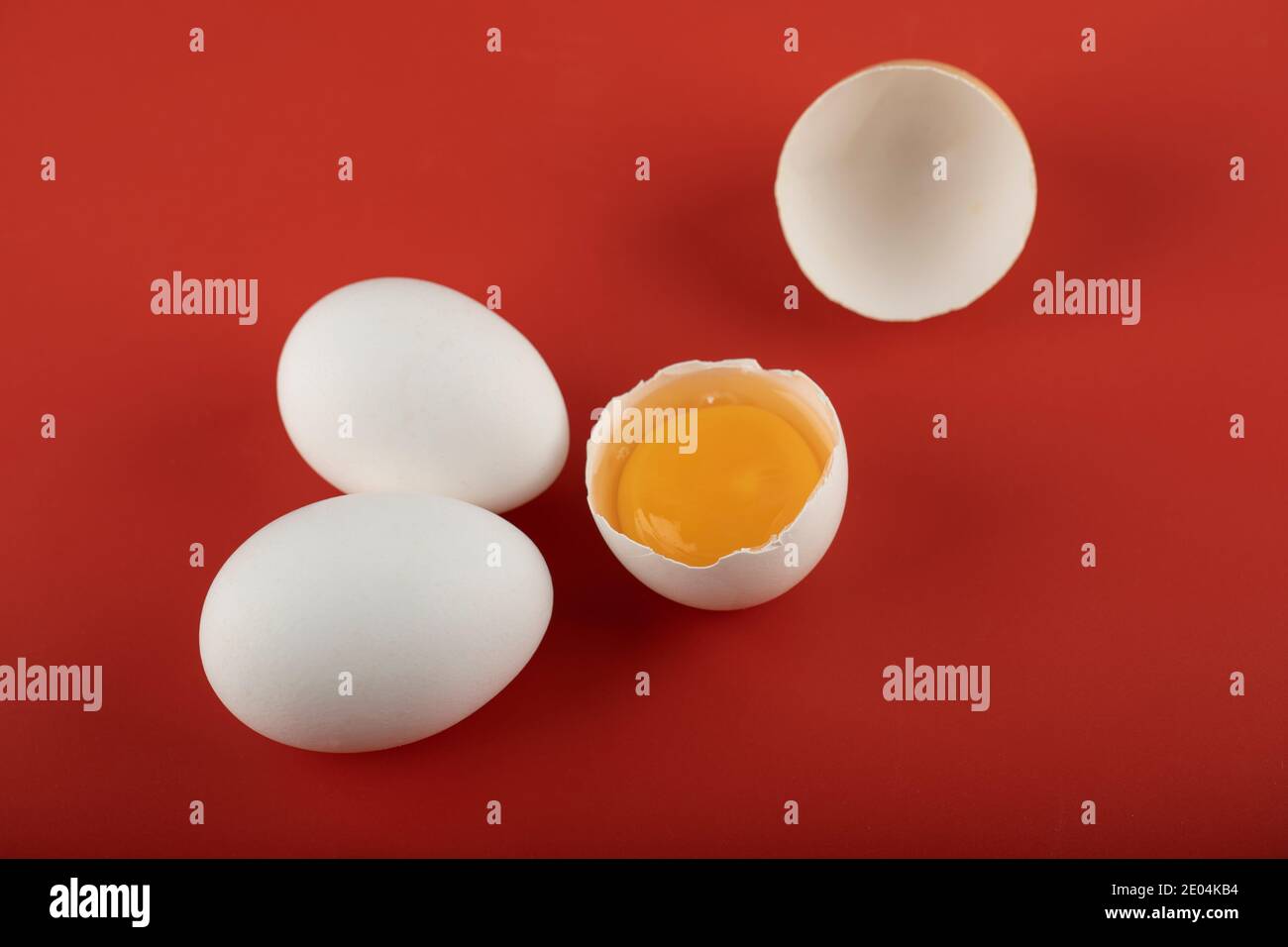 Broken whole raw eggs hi-res stock photography and images - Alamy