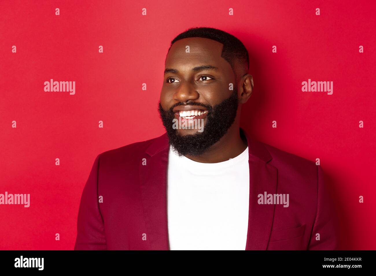 Close-up of handsome african american man with beard, looking left and ...