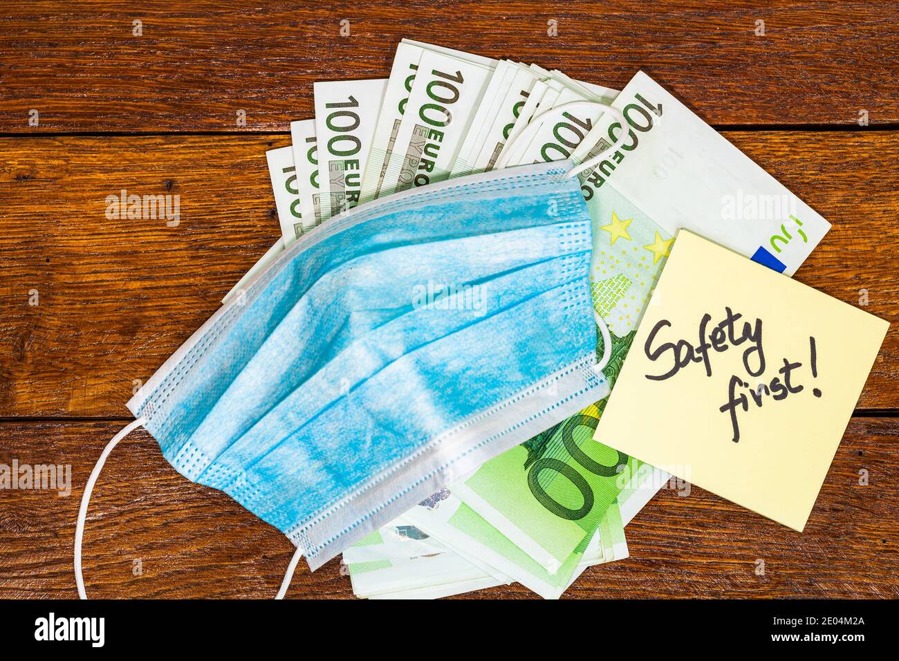 Money with surgical mask on wooden table. Flu disease virus spreading ...