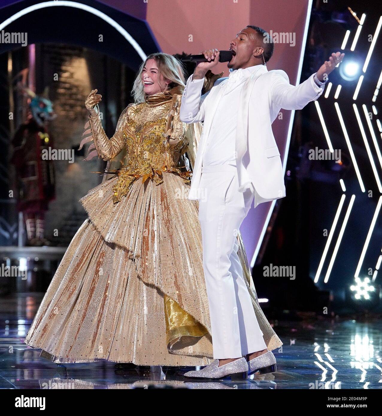 THE MASKED SINGER, from left: LeAnn Rimes (revealed as the Sun), host ...