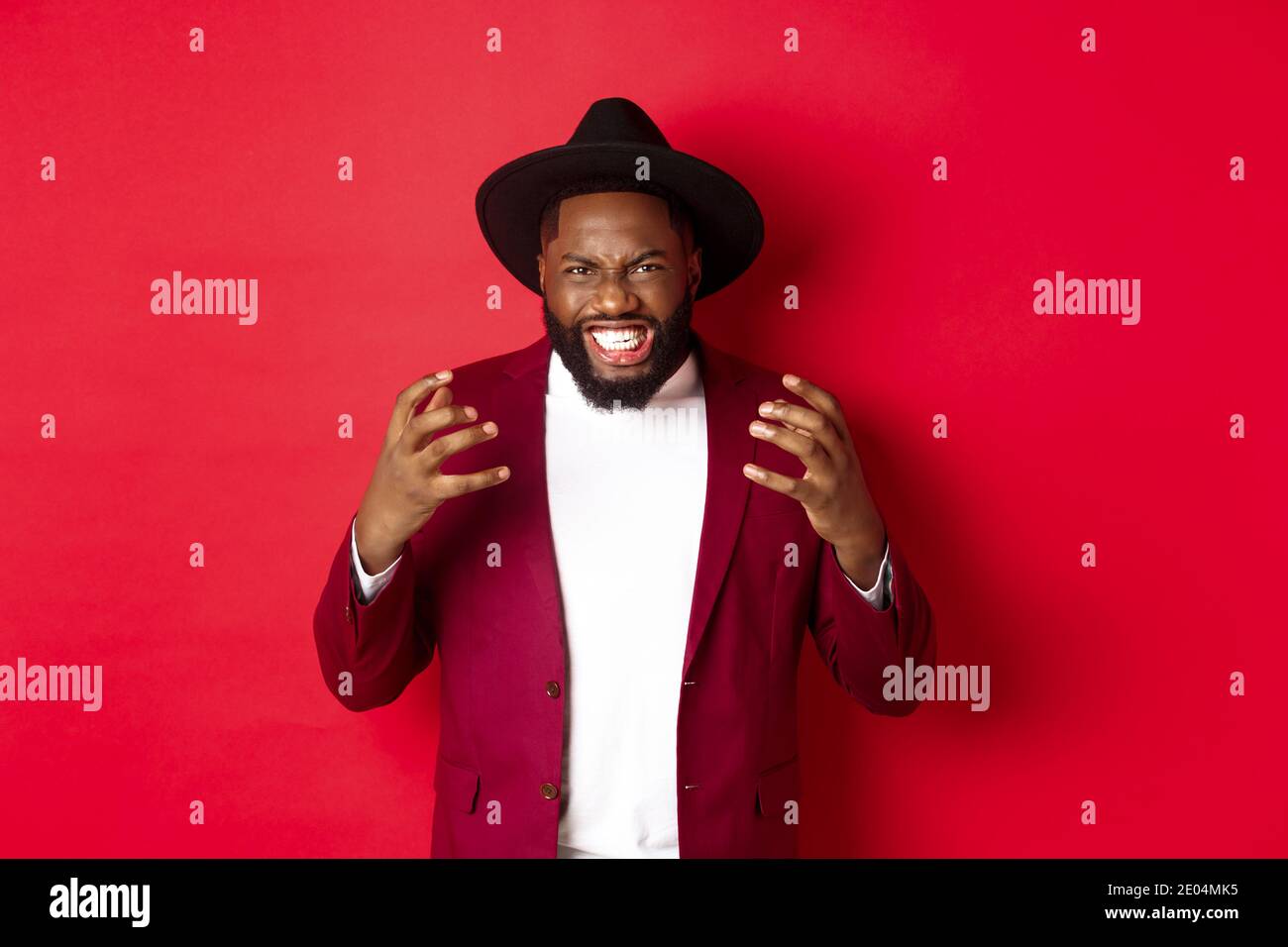 Angry african american man looking aggressive, shaking hands and ...