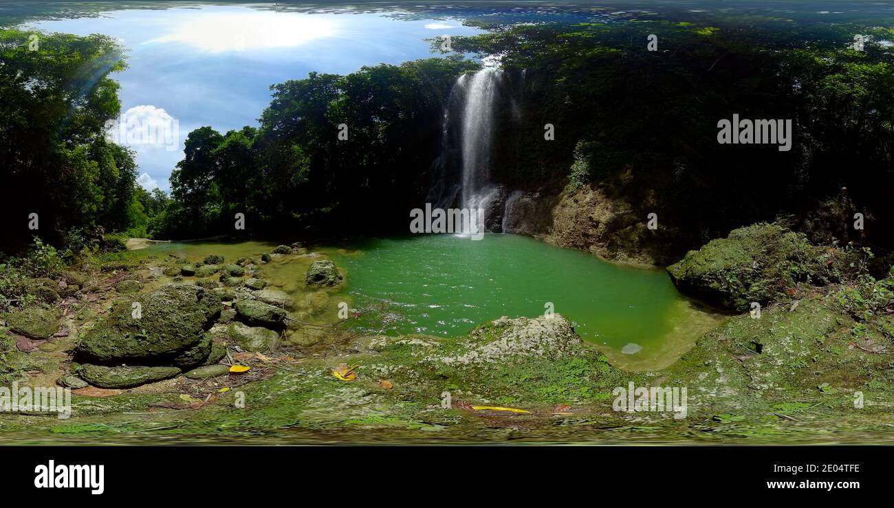 Kawasan Falls in green forest, aerial drone. Waterfall in the tropical mountain jungle. Bohol ...