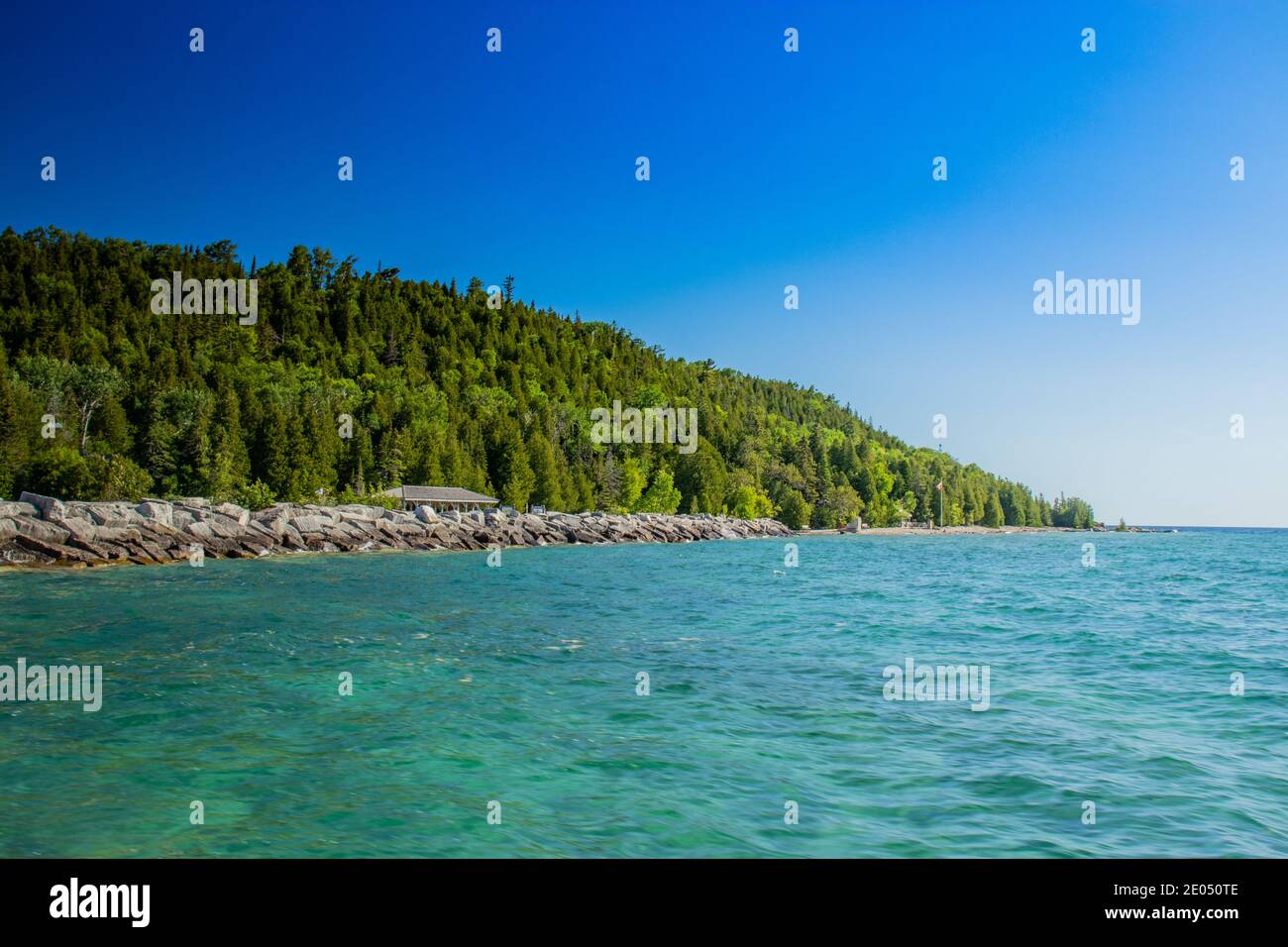 Water meets rocks and the small cliffs meet the sky on Lake Huron, ON ...