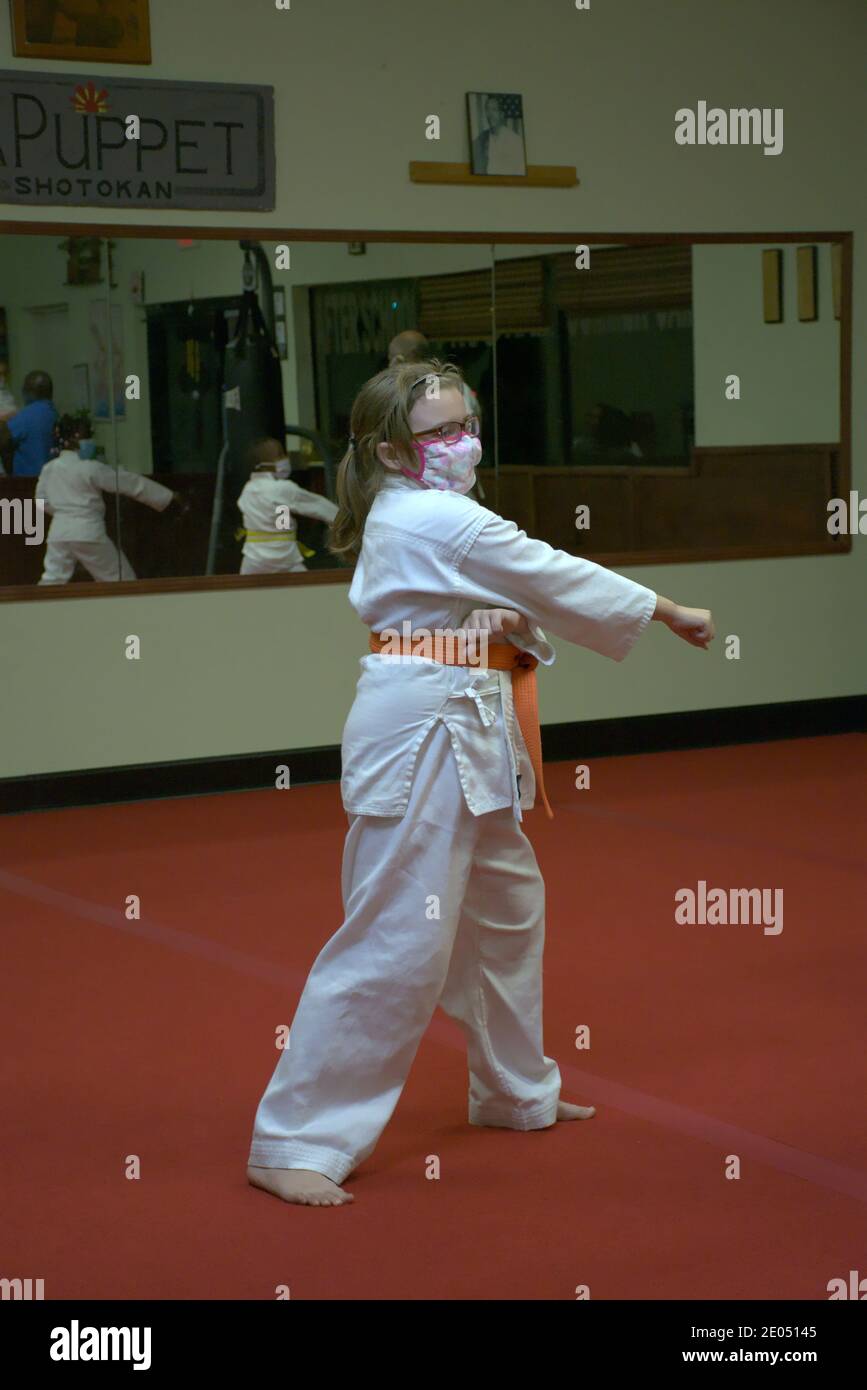 This action photo is of my daughter in her Karate class. Karate is a ...