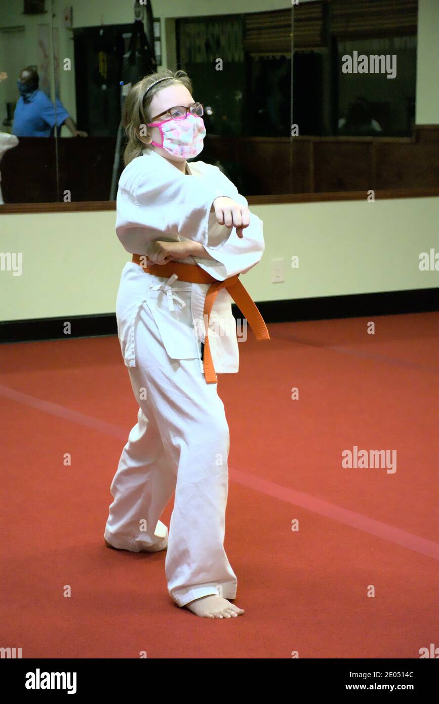 This action photo is of my daughter in her Karate class. Karate is a ...