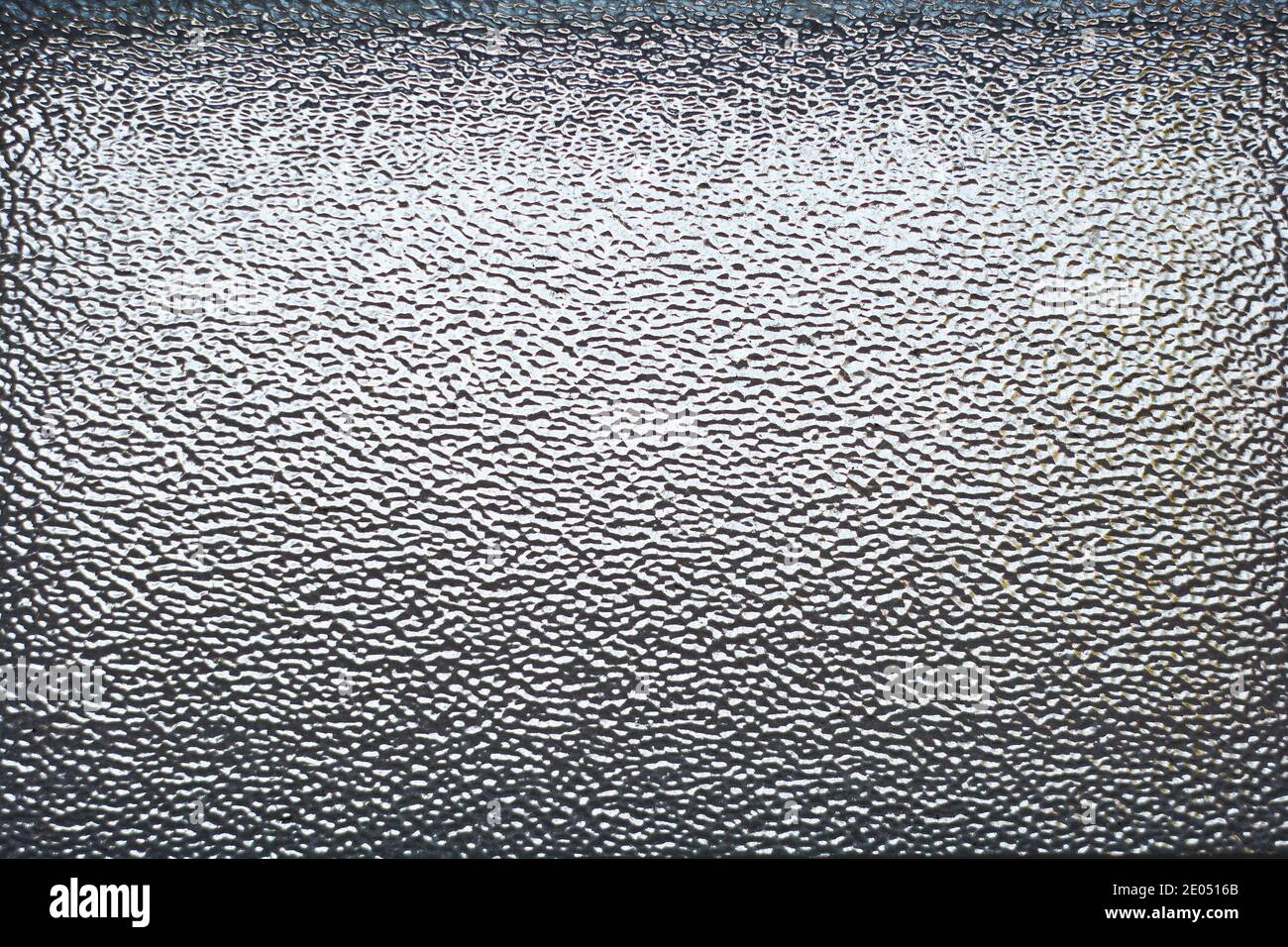Gray corrugated texture of interior glass window with light coming from ...