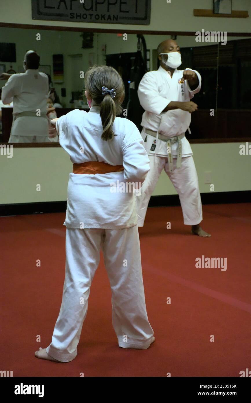 This action photo is of my daughter in her Karate class. Karate is a ...