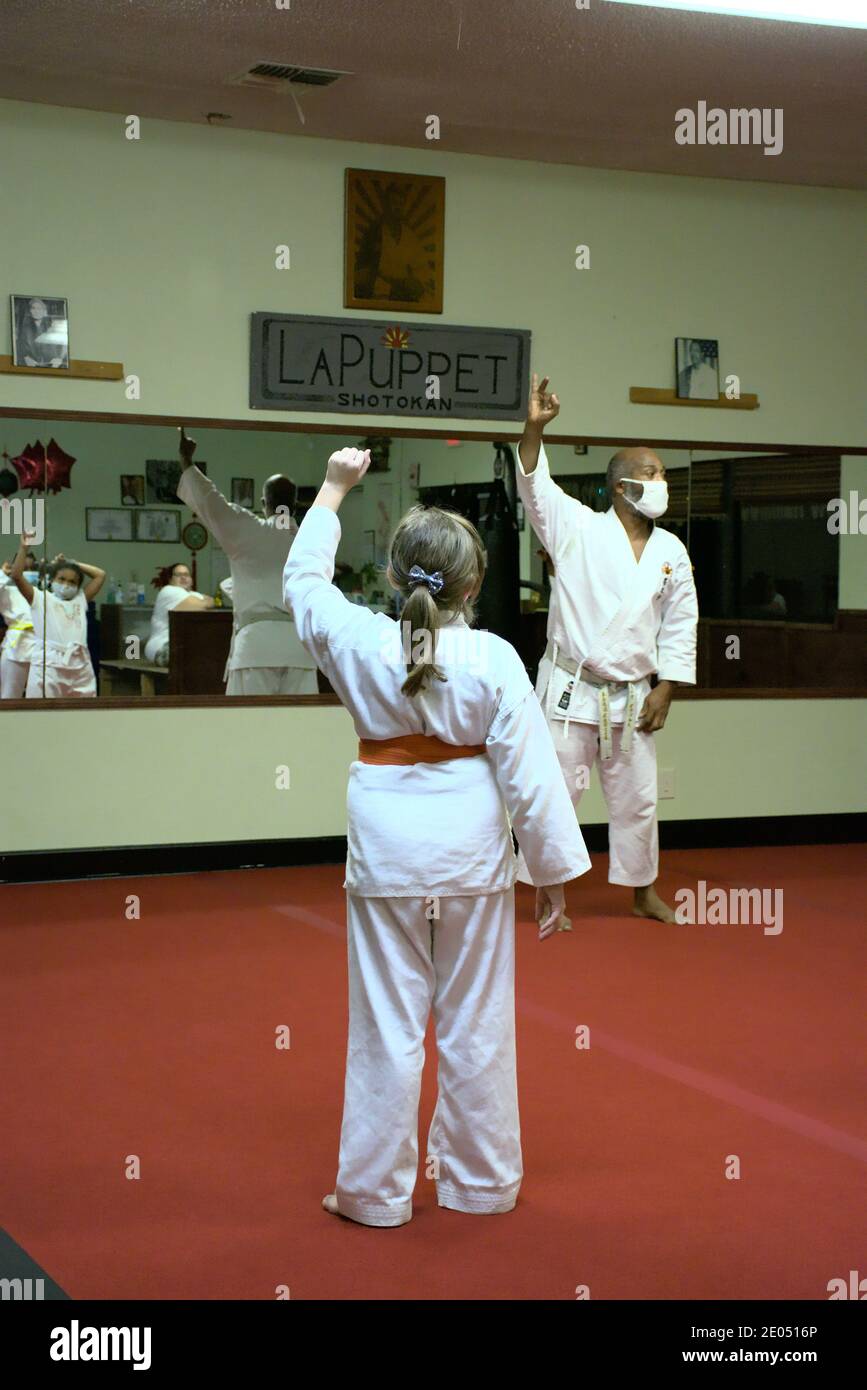 This action photo is of my daughter in her Karate class. Karate is a ...