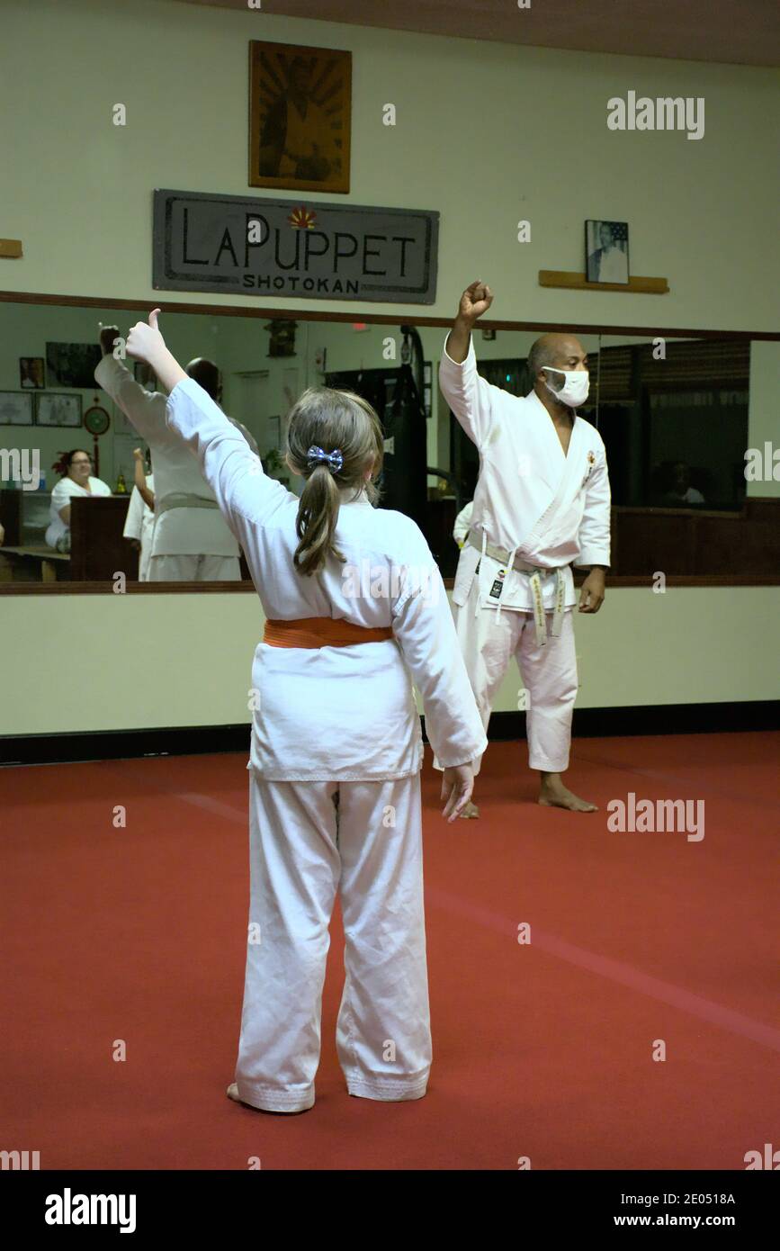This action photo is of my daughter in her Karate class. Karate is a ...