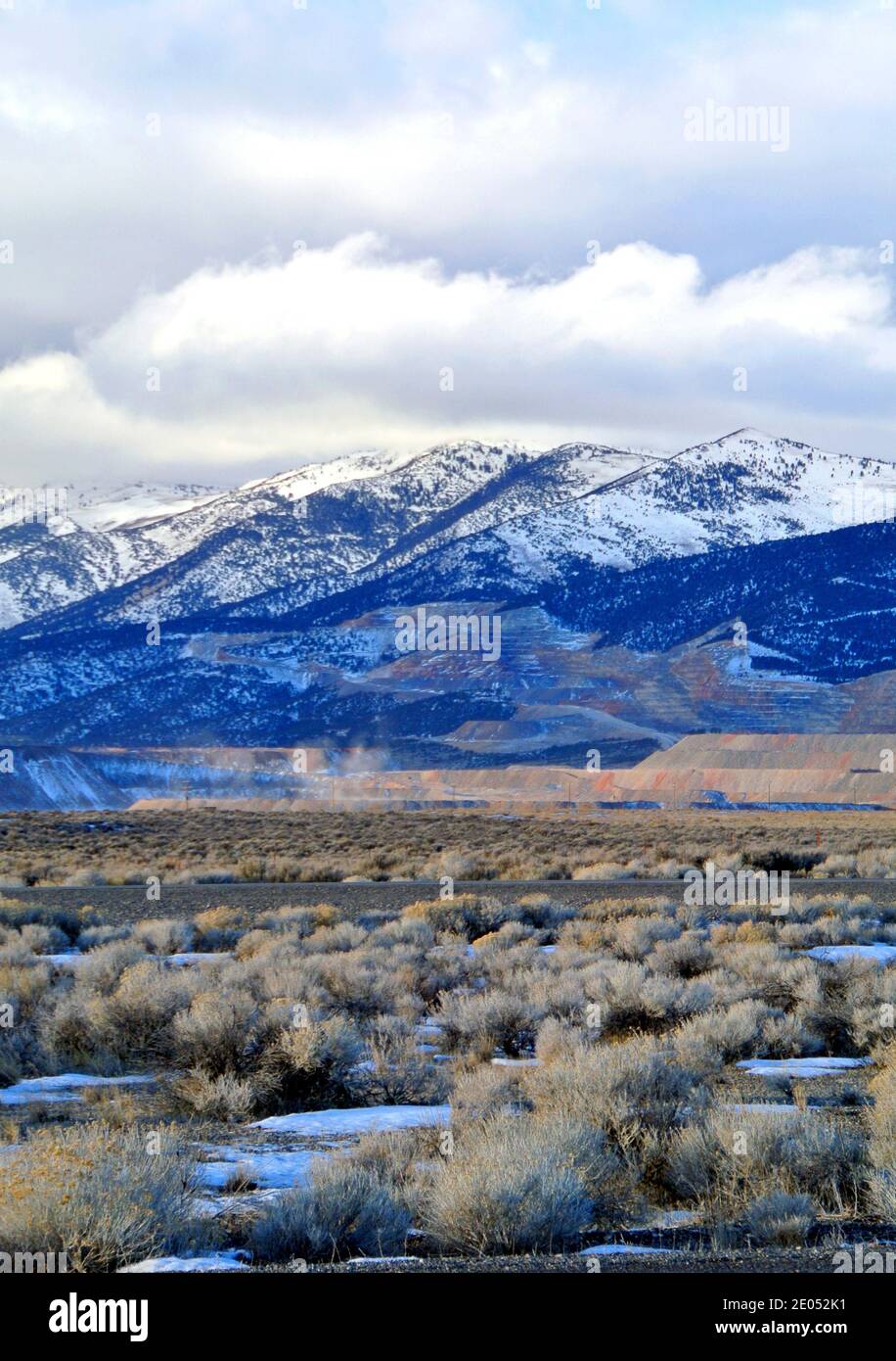 snow capped mountains tower over northern Nevada usa ranches and small ...