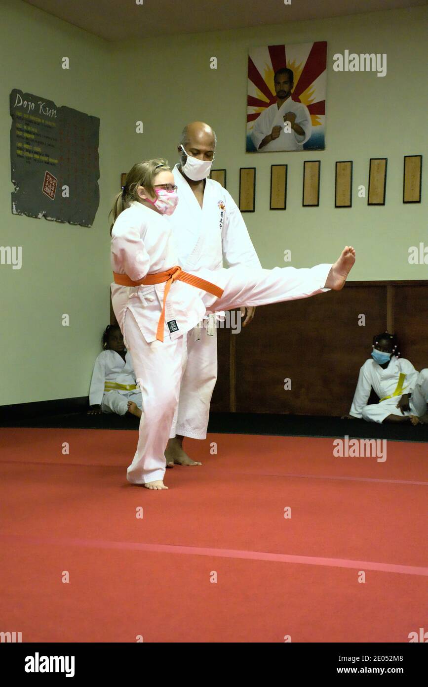 This action photo is of my daughter in her Karate class. Karate is a ...