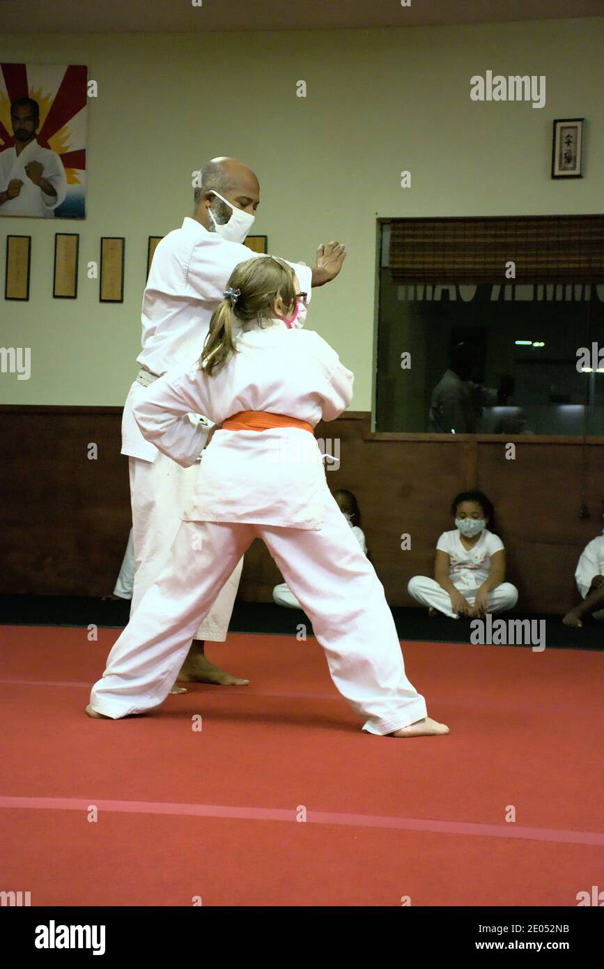 This action photo is of my daughter in her Karate class. Karate is a ...
