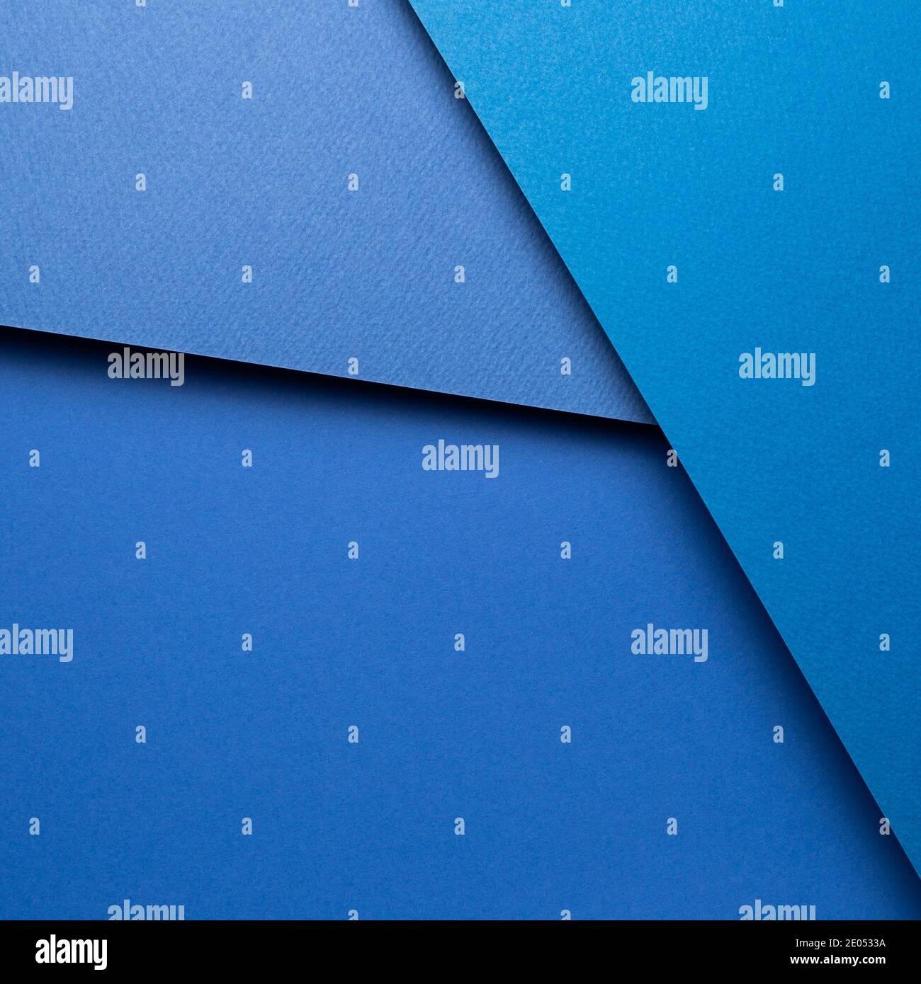 Abstract blue layered color paper background Stock Photo - Alamy