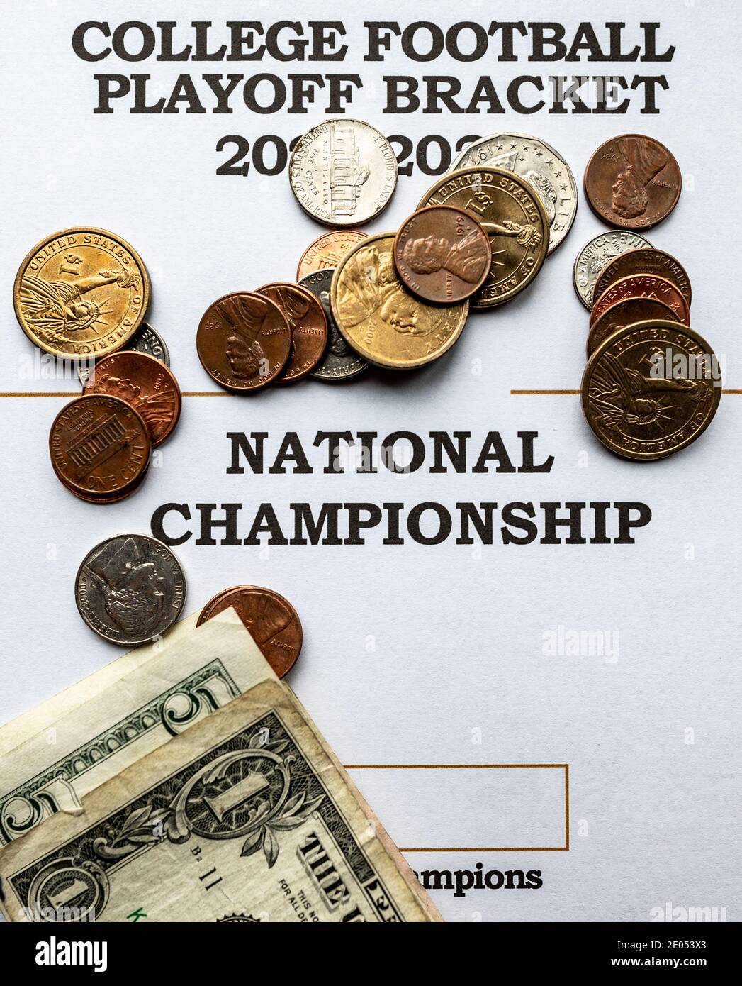 Filling out a sports bracket and betting money on the winner Stock ...