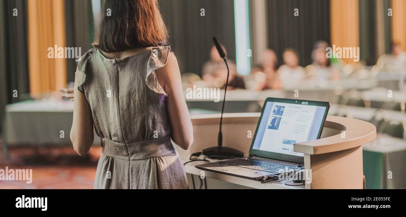 Female speaker at Business Conference and Presentation. Audience at the ...