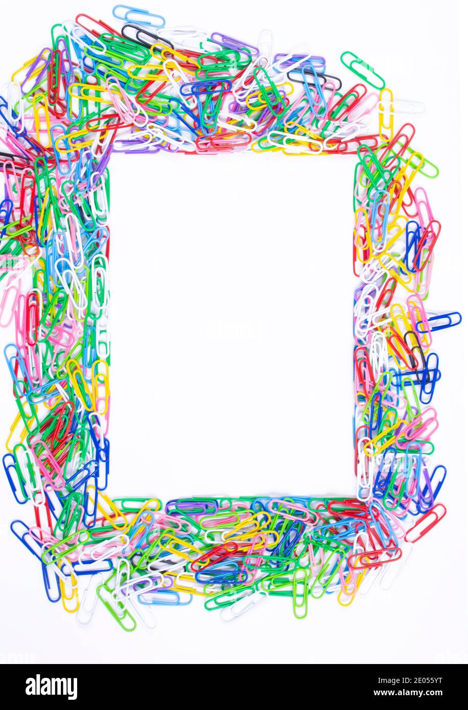 Frame made of colorful paper clips on white background,top view with ...