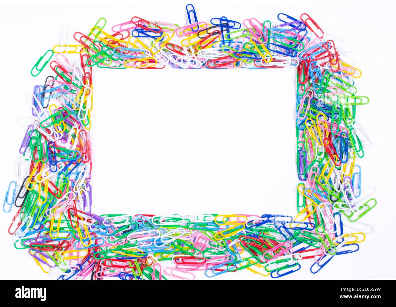 Frame made of colorful paper clips on white background,top view with ...