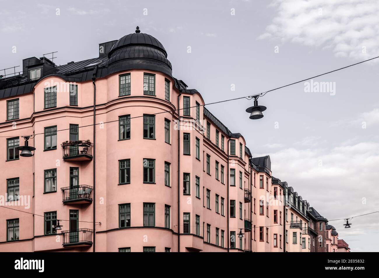 Beautiful pink building on cloudy sky background. Stockholm, Sweden ...