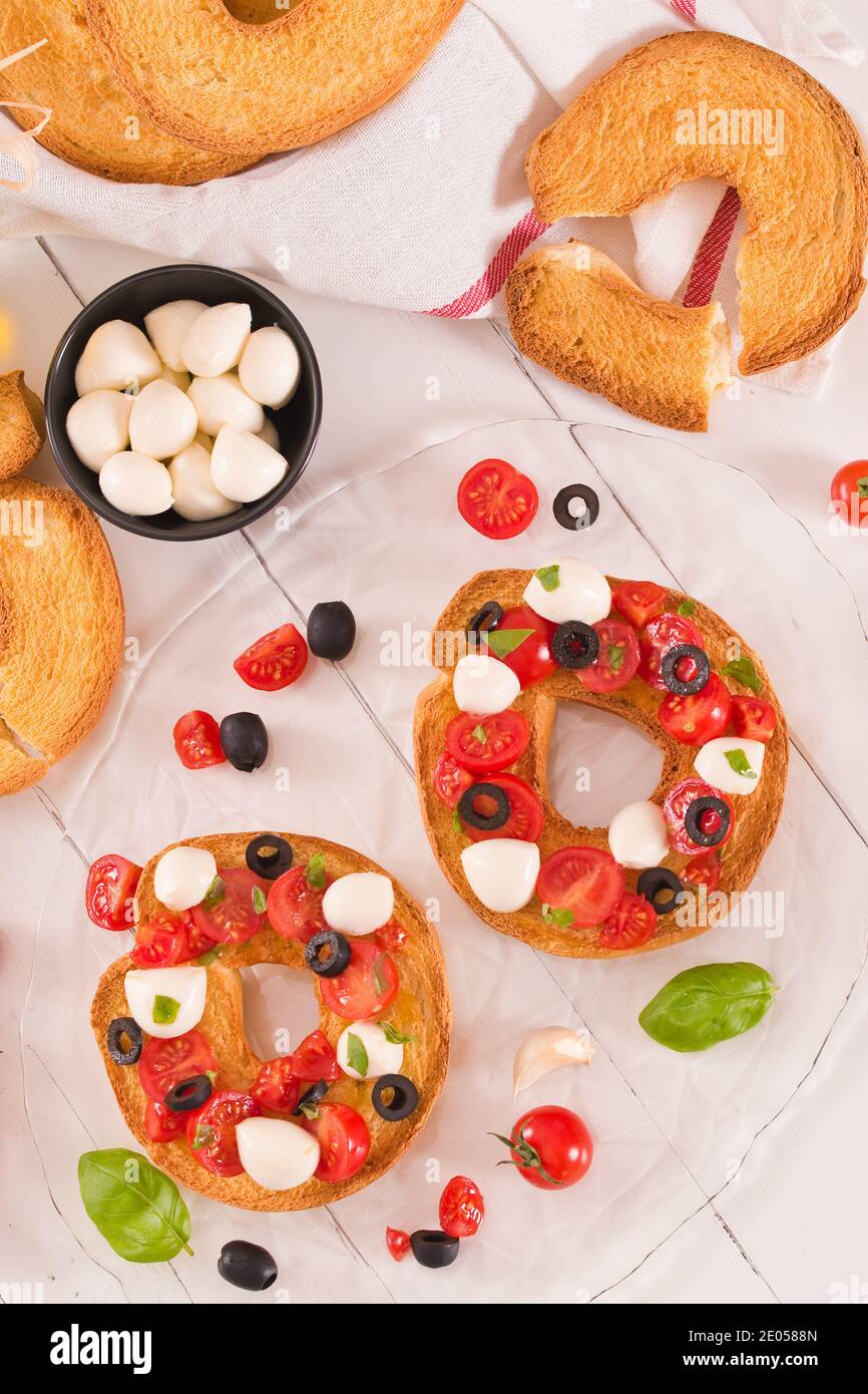 Friselle with tomatoes and mozzarella cheese Stock Photo - Alamy