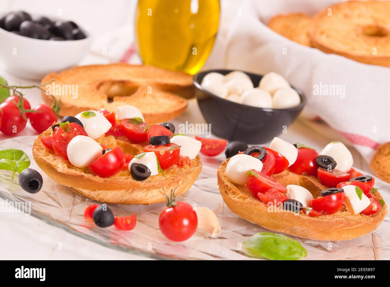 Friselle with tomatoes and mozzarella cheese Stock Photo - Alamy