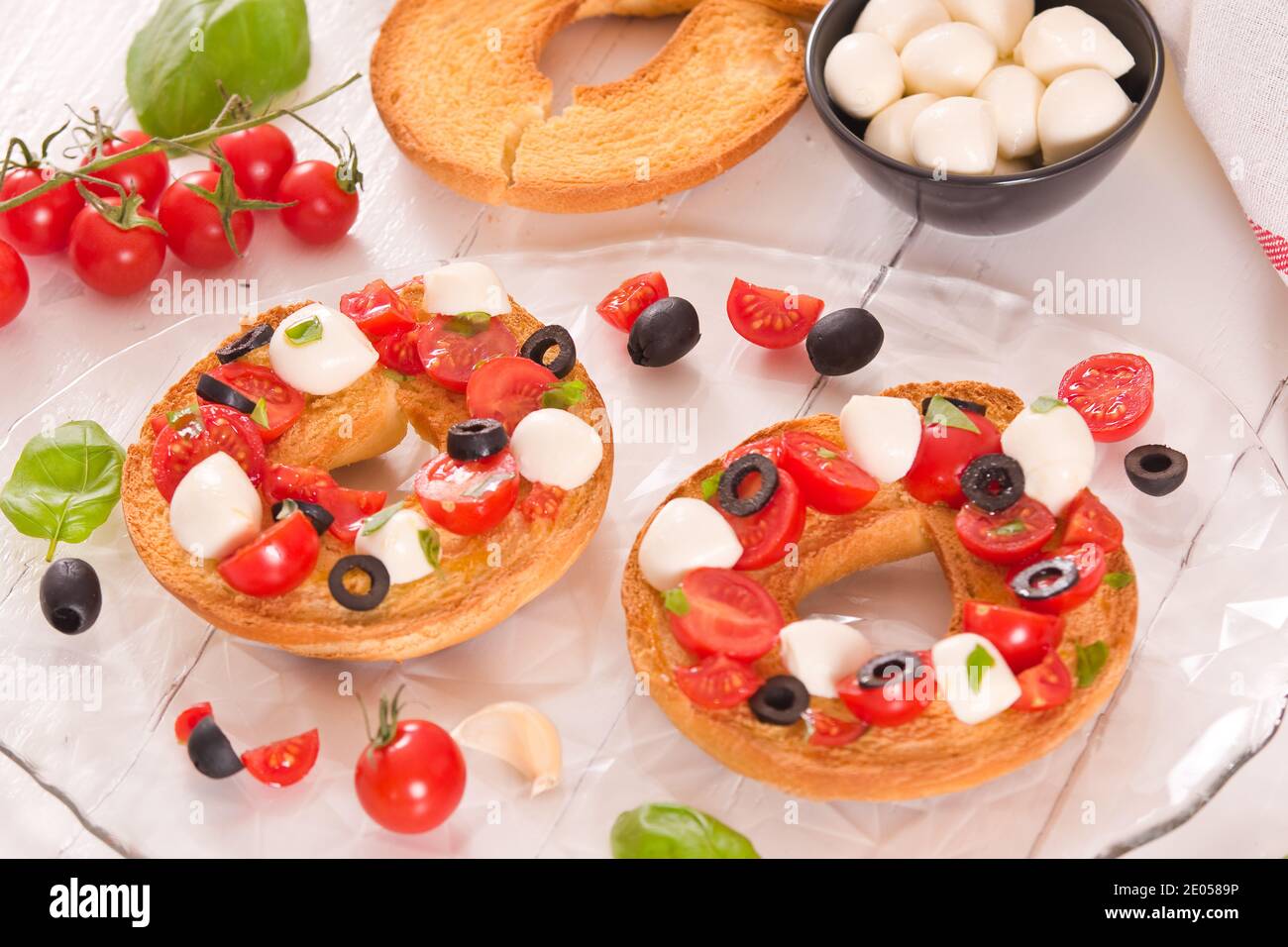 Friselle with tomatoes and mozzarella cheese Stock Photo - Alamy