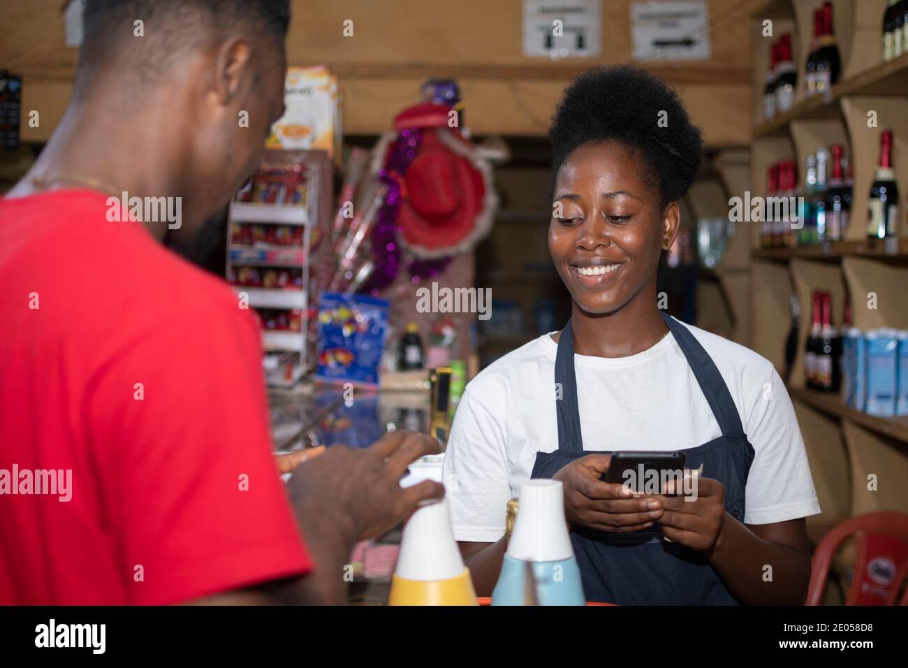 African store attendant hi-res stock photography and images - Alamy