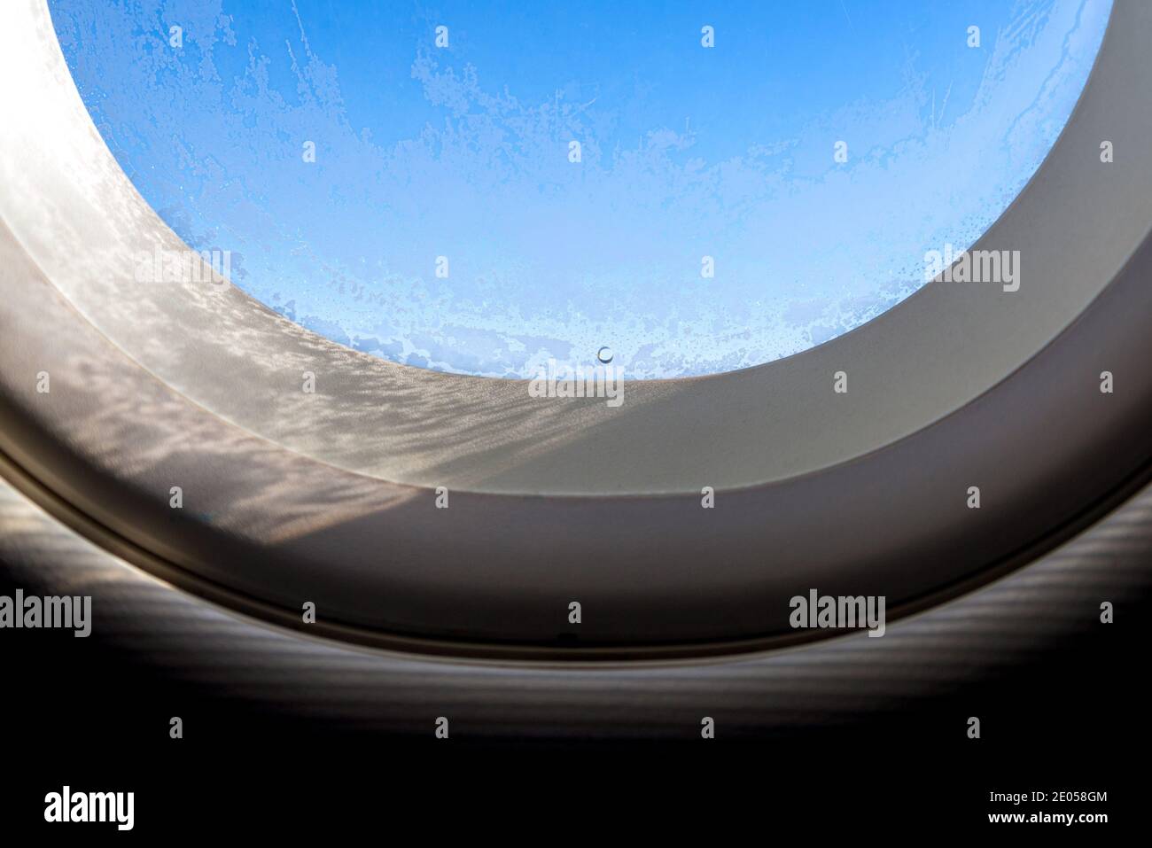 The window of the airplane. A view of porthole window on board an ...