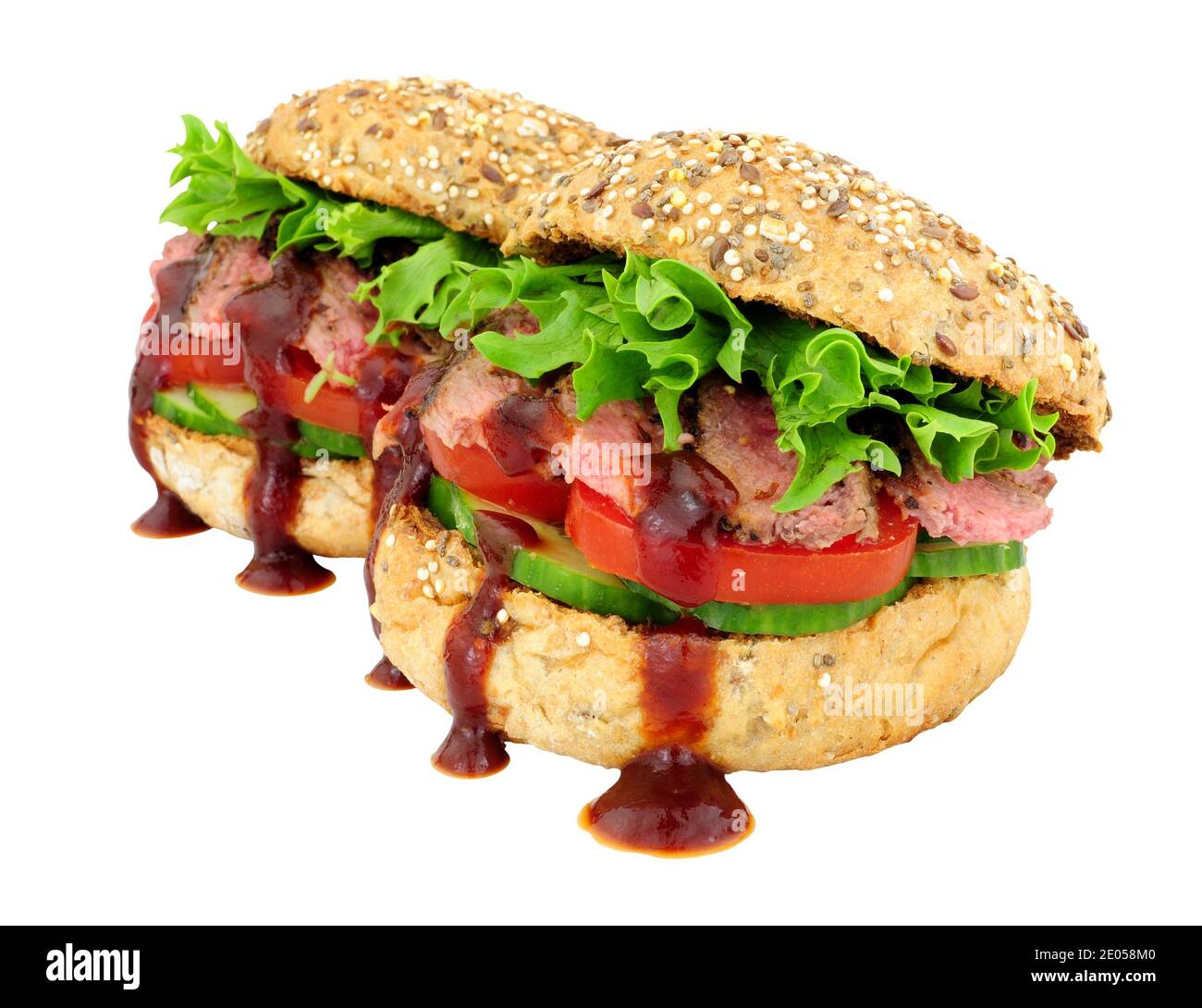 Steak meat and salad sandwiches with barbecue sauce in multi seed ...
