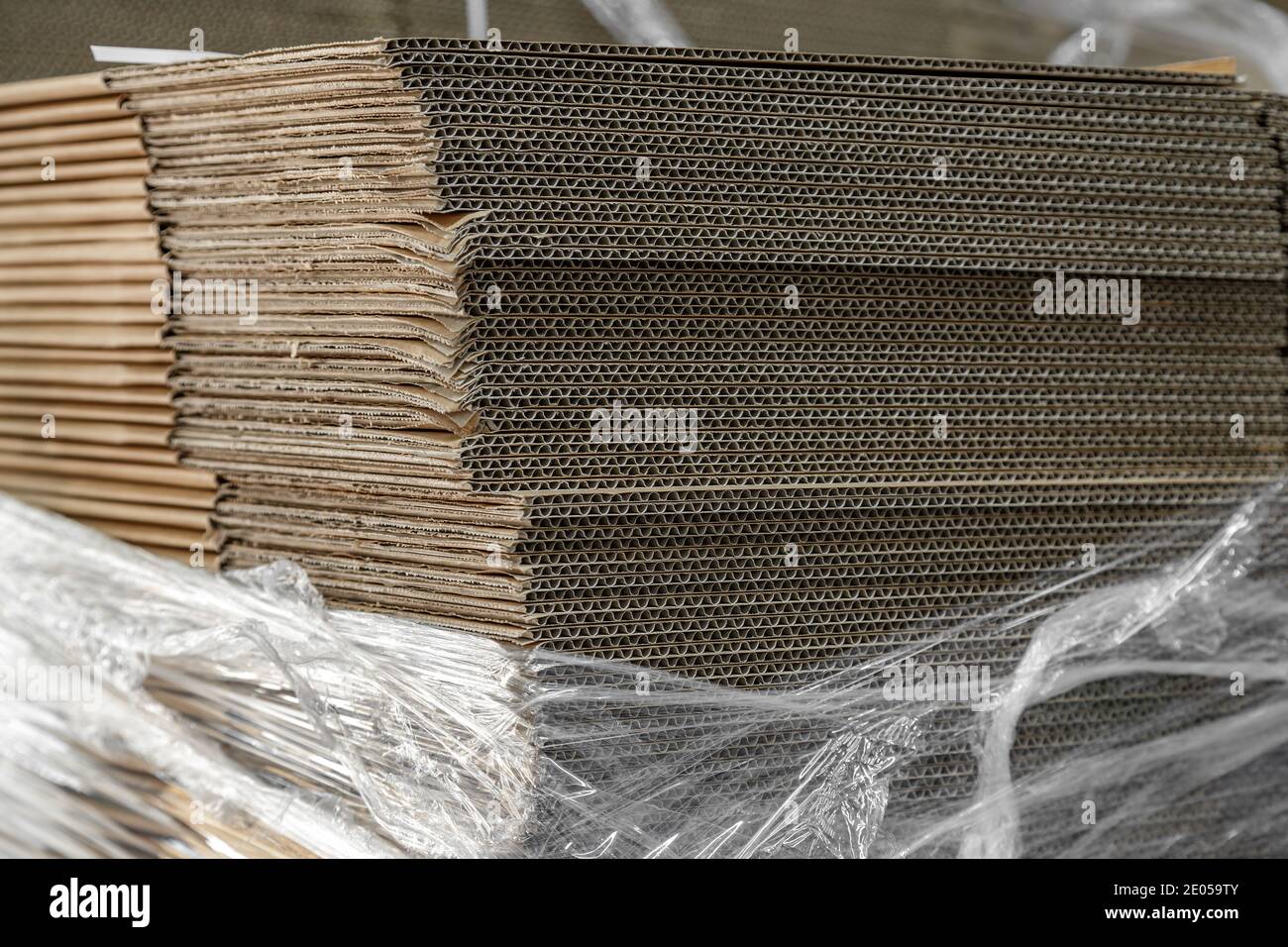 Unused cardboard boxes in a store warehouse Stock Photo - Alamy
