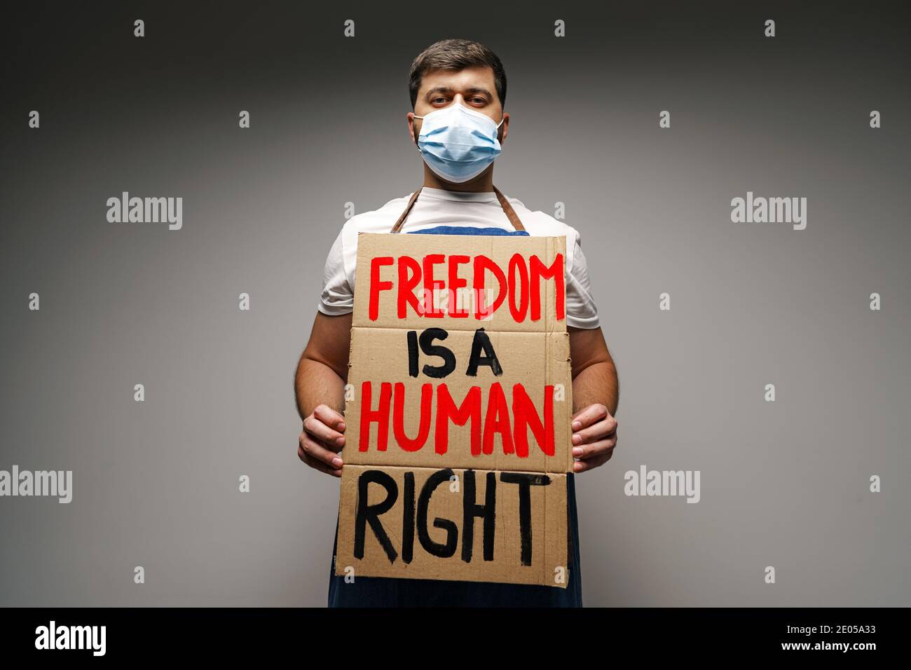 'Freedom is a human right' placard in hands of protester man Stock ...