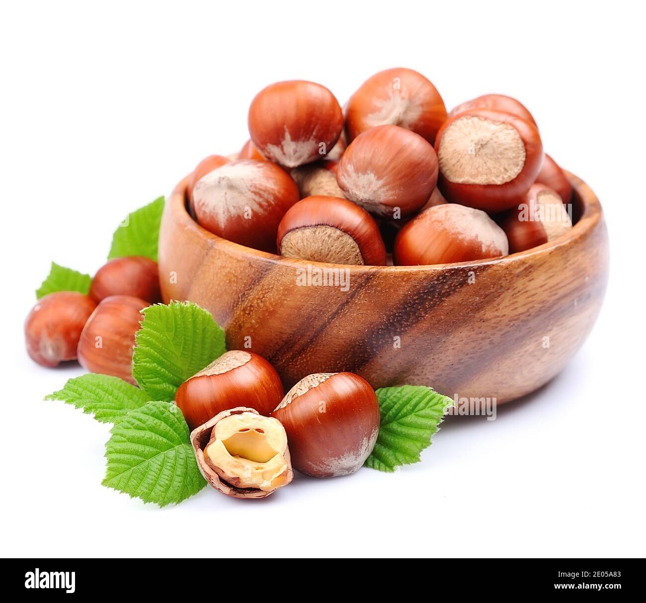 Filbert nuts with leaf on white background Stock Photo - Alamy