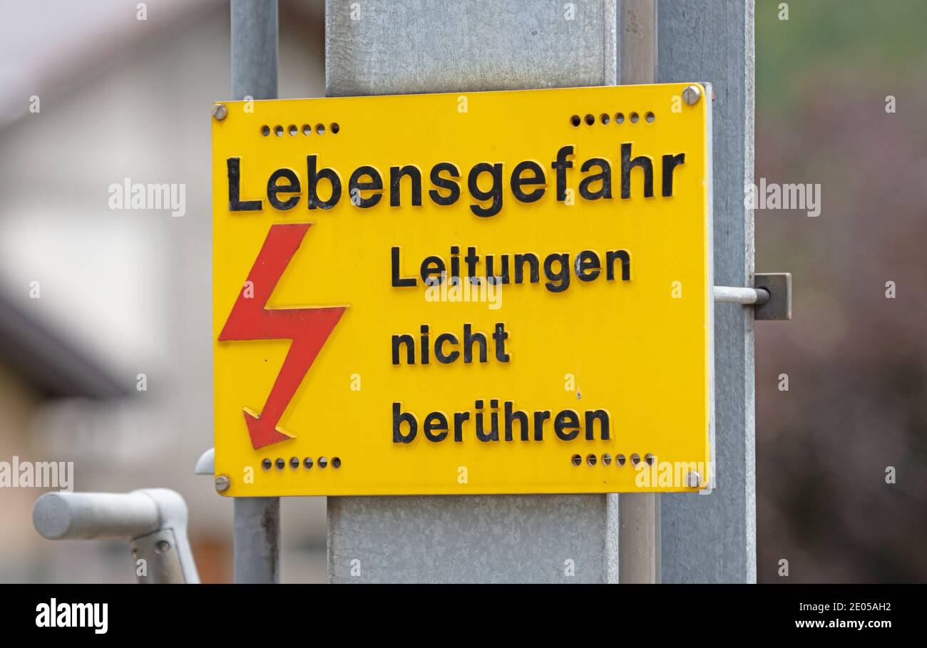 German warning sign `Don't touch high voltage power lines, danger to ...