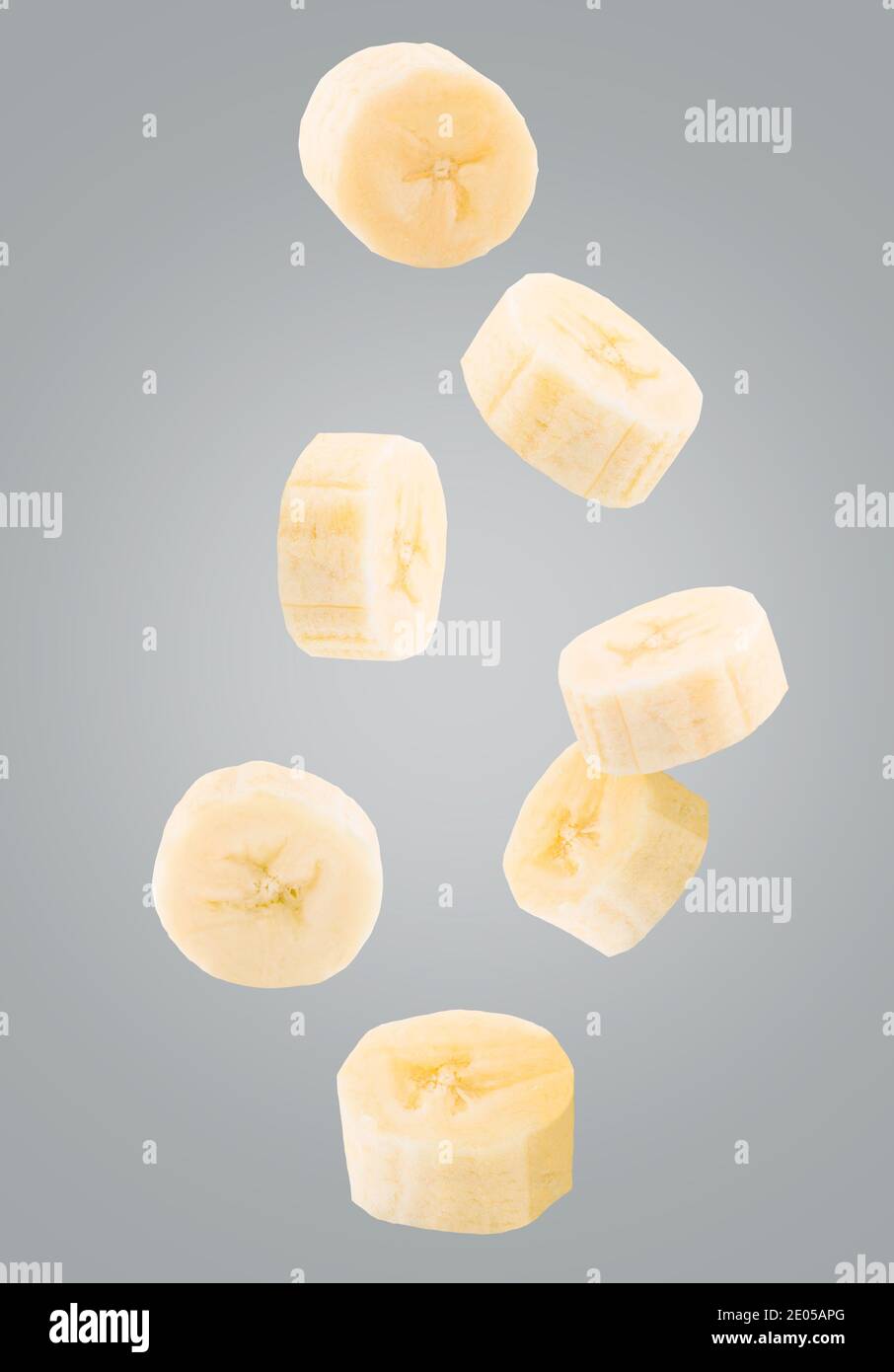 Falling sliced fresh banana isolated on white Stock Photo - Alamy