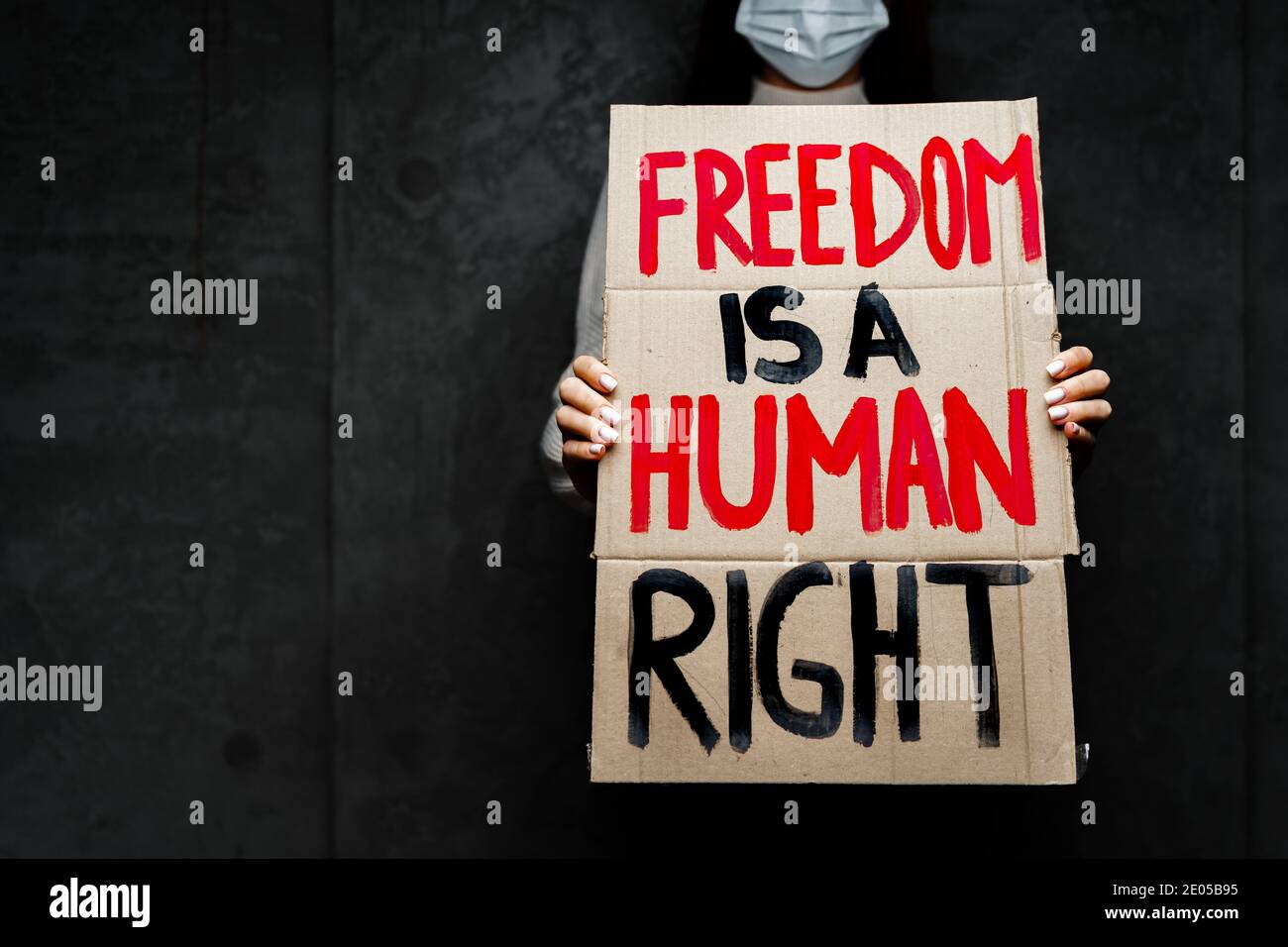 Protest placard 'Freedom is a human right' in hands of a woman Stock ...
