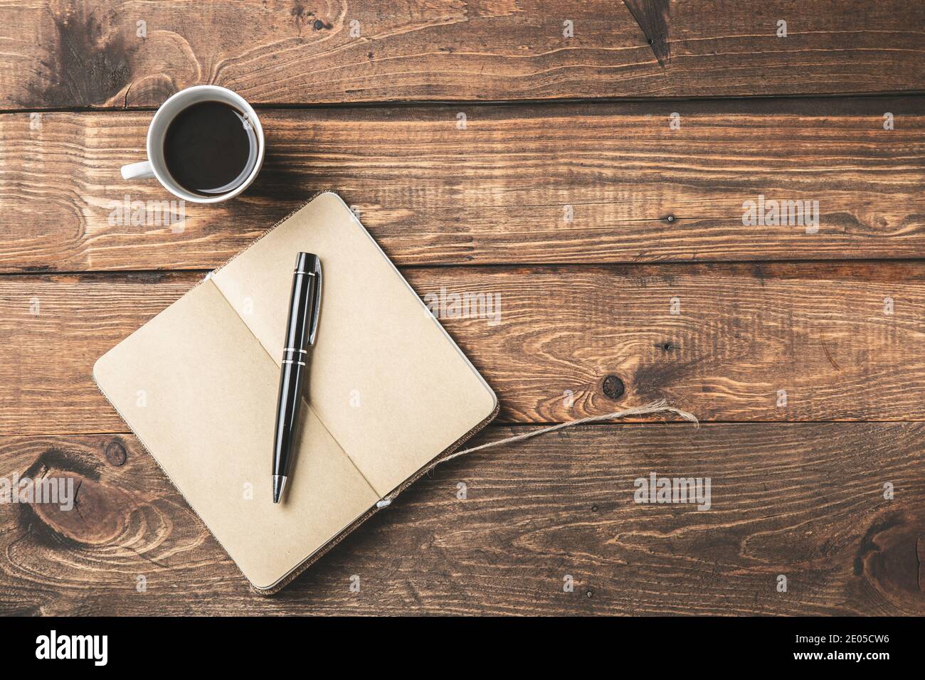 Simple work place. Wooden office desk table, with empty notebook,pen ...