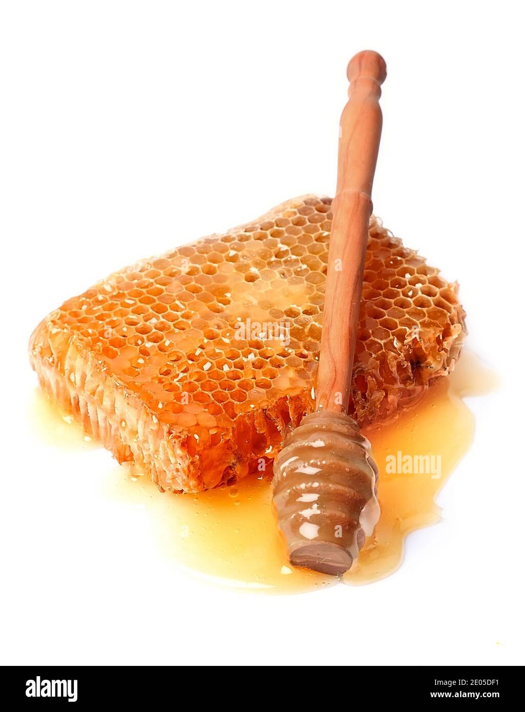 Honey dipper with honeycomb close up on white Stock Photo - Alamy