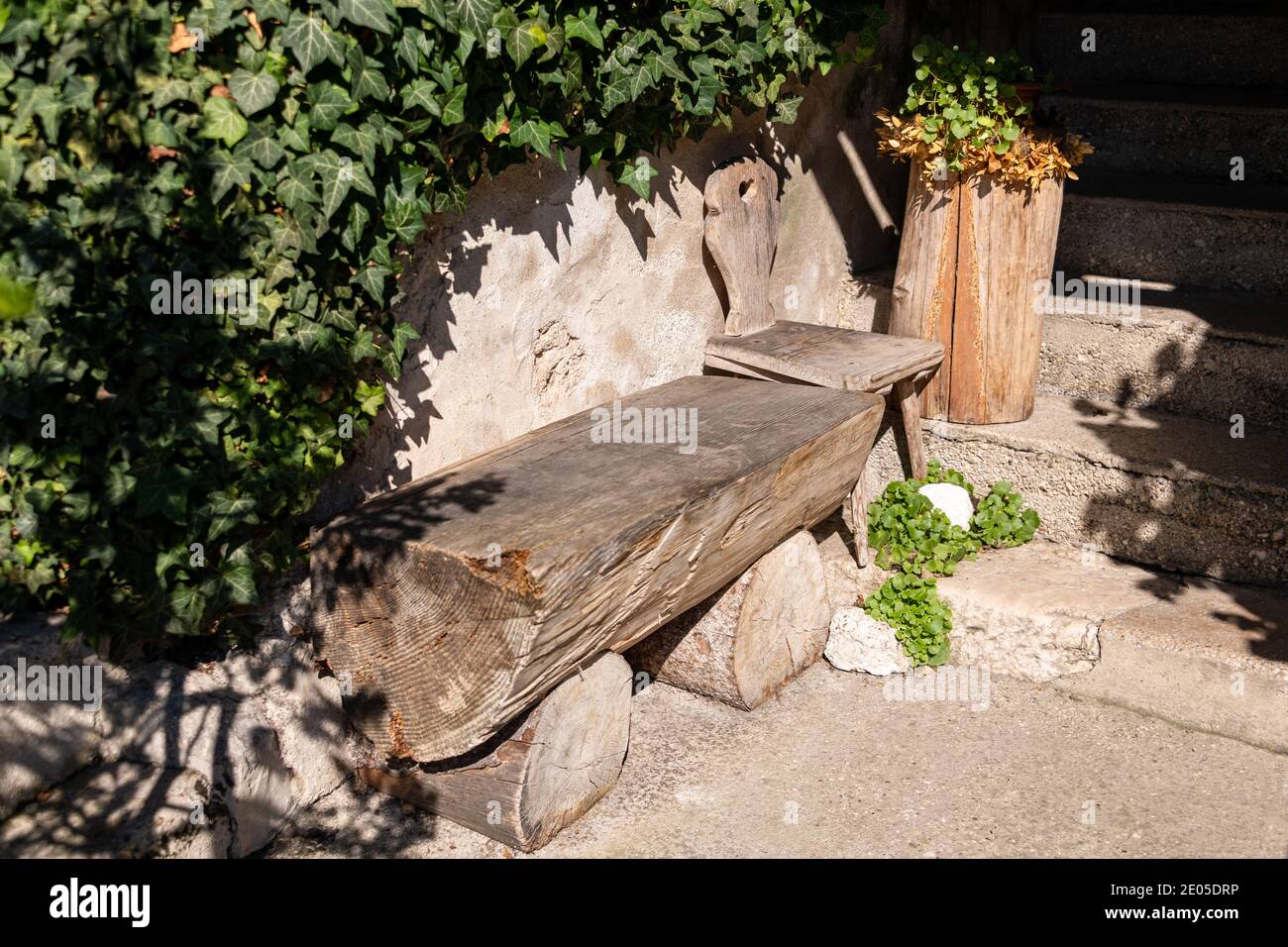Take a rest on a crafted wooden bench Stock Photo - Alamy