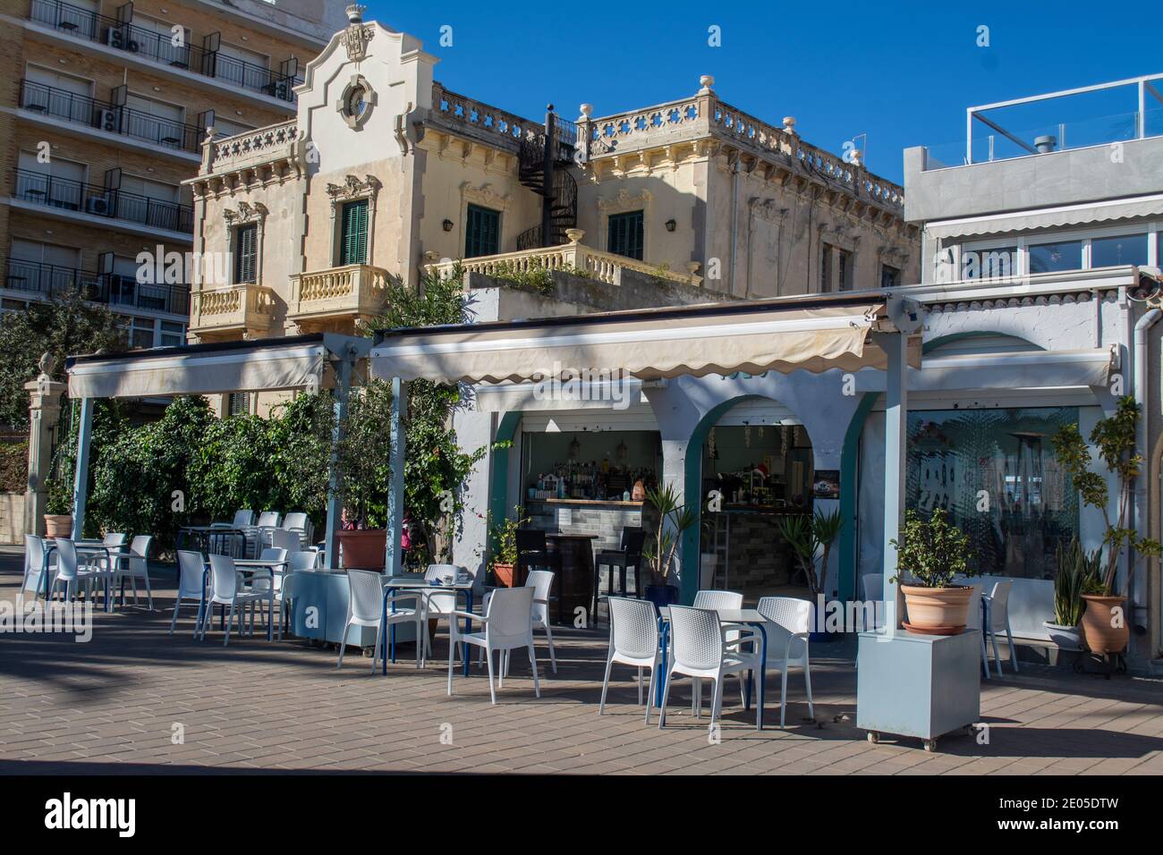 Spanish bar with a traditional building in the background Stock Photo ...