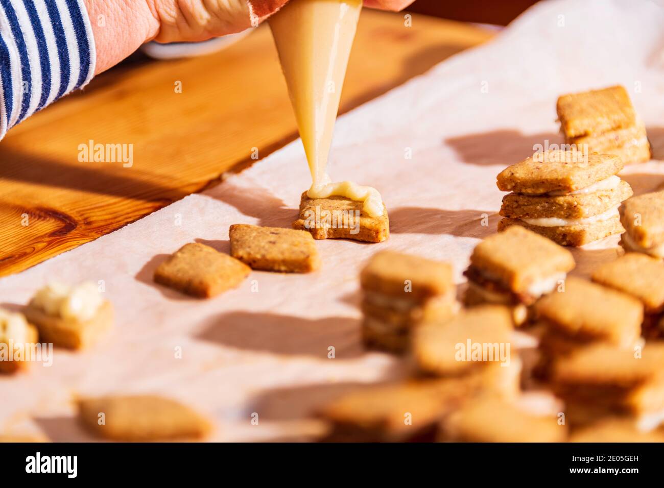 Filling Marzipan Cream With A Pastry Bag Into Christmas Cookies Stock ...