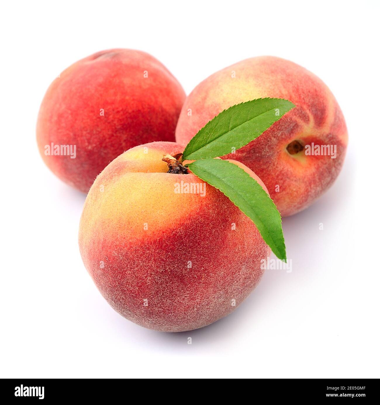 Peach fruits on a white background Stock Photo - Alamy
