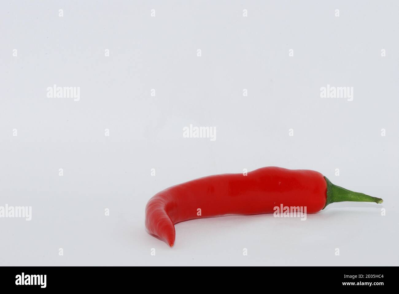 spicy red chilli on white background, front right view Stock Photo - Alamy