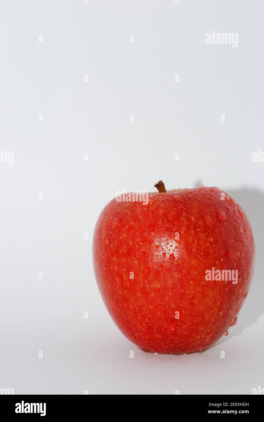 fresh sweet red apple with water drops on white background view high ...