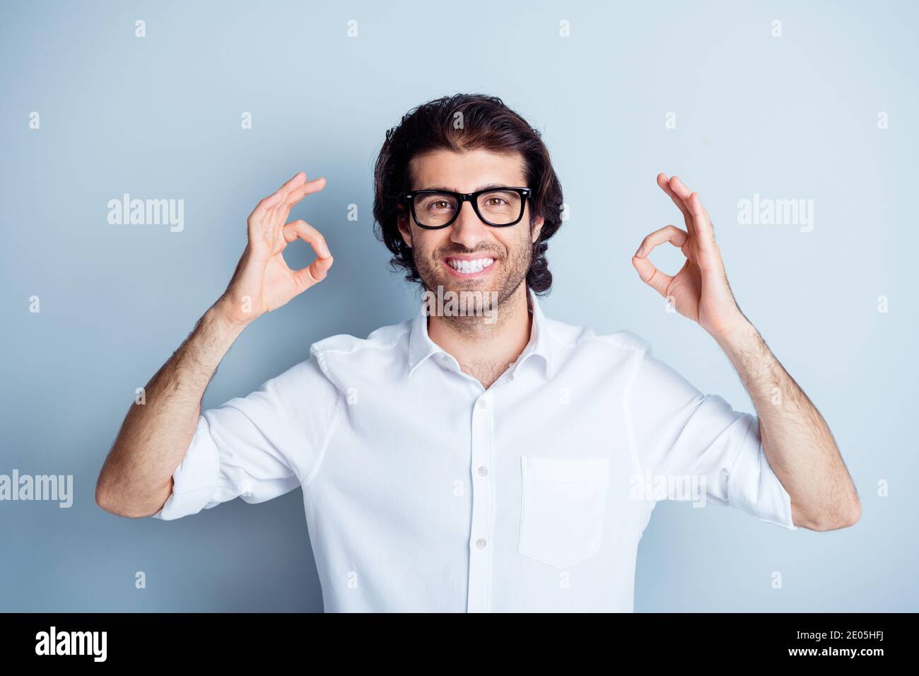 Photo portrait of man showing two okay signs isolated on clear white ...