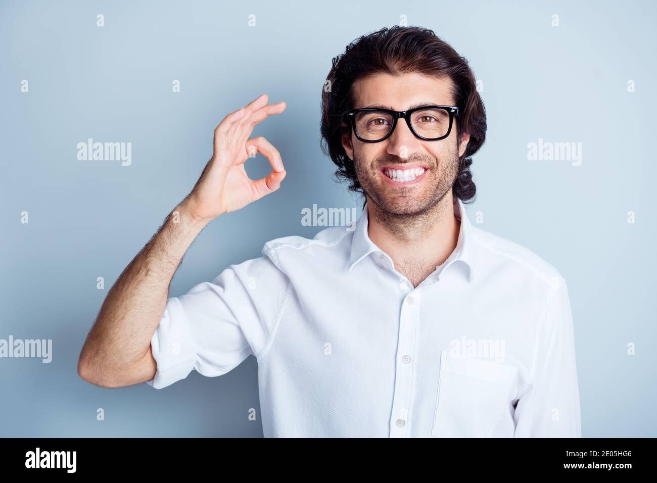 Photo portrait of smiling guy showing okay sign isolated on clear white ...