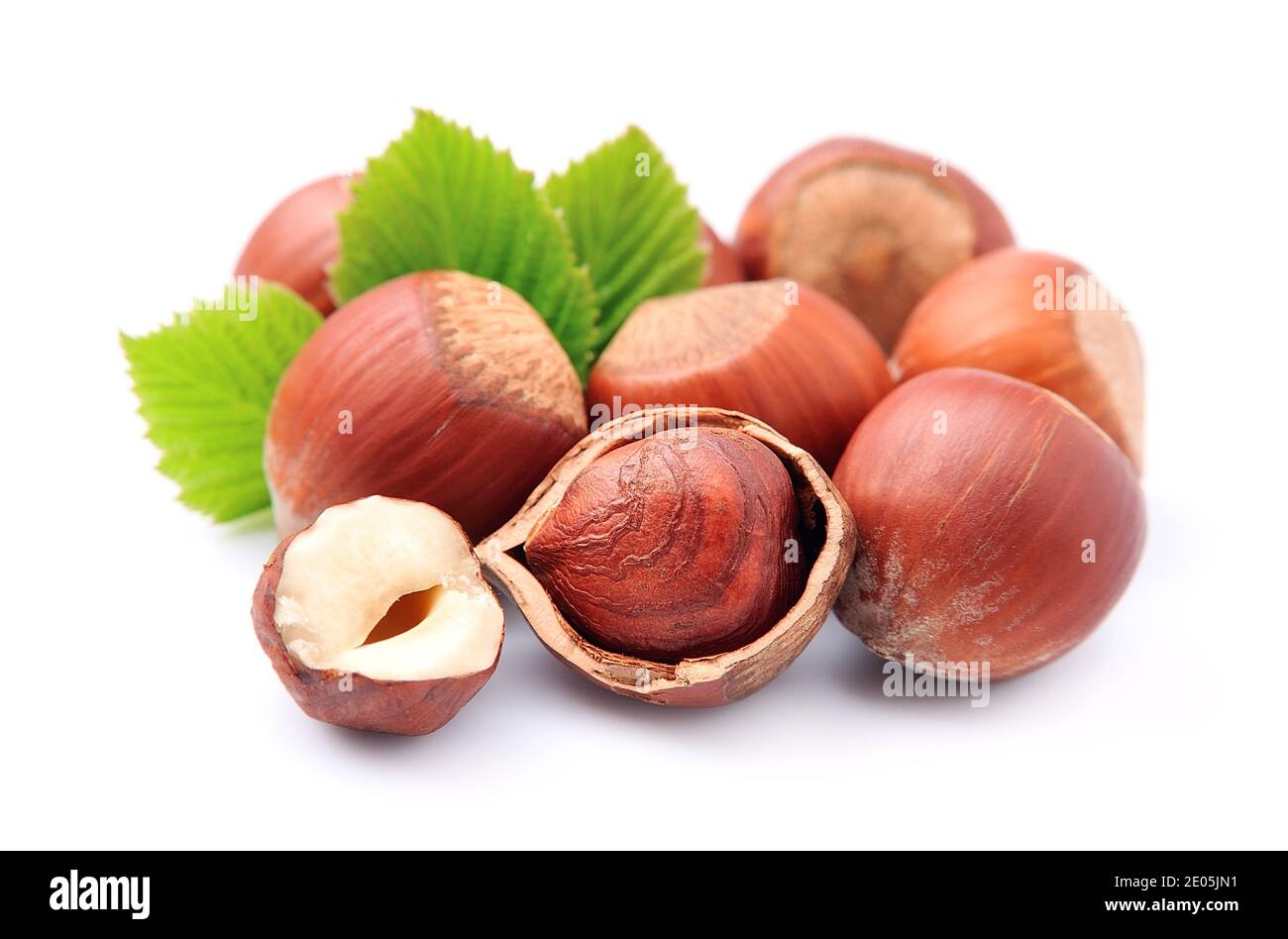 Filbert nuts with leaves close up on white Stock Photo - Alamy
