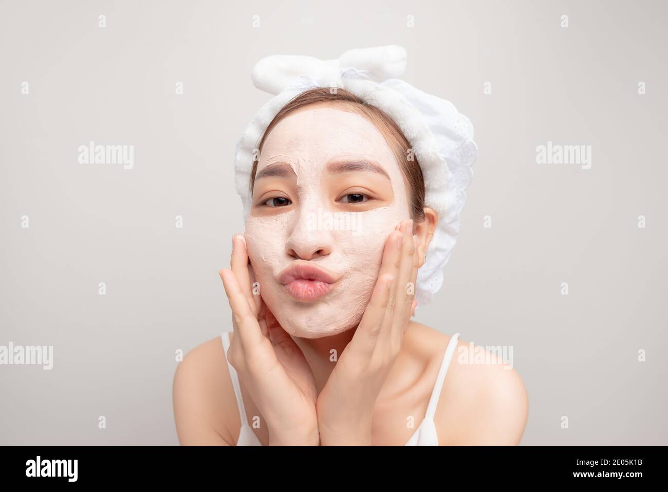 a woman put a mask on her face after a shower Stock Photo - Alamy