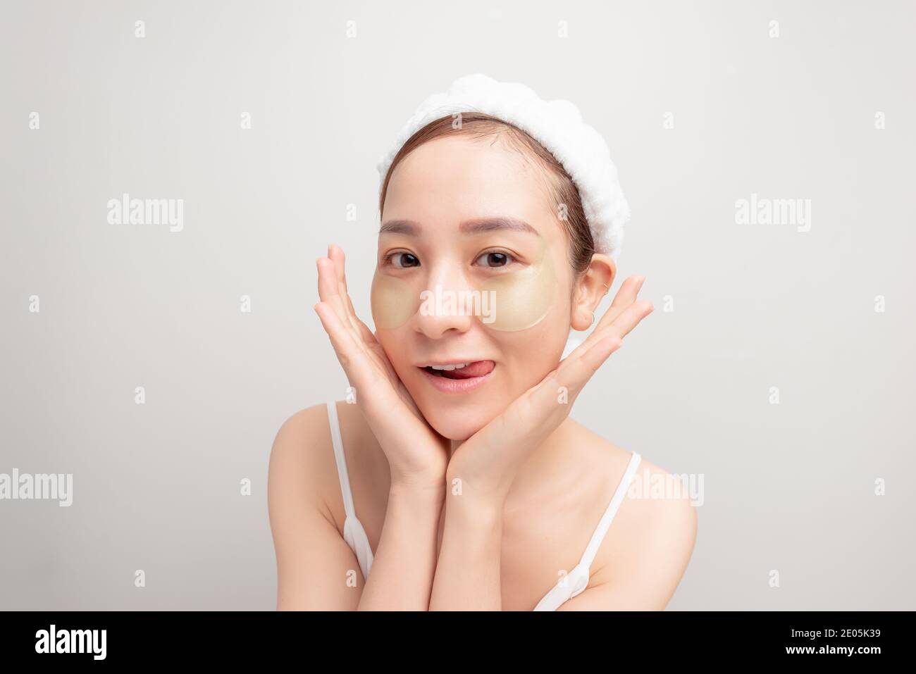 Beauty model face with healthy clean skin using under eye patches. Anti ...