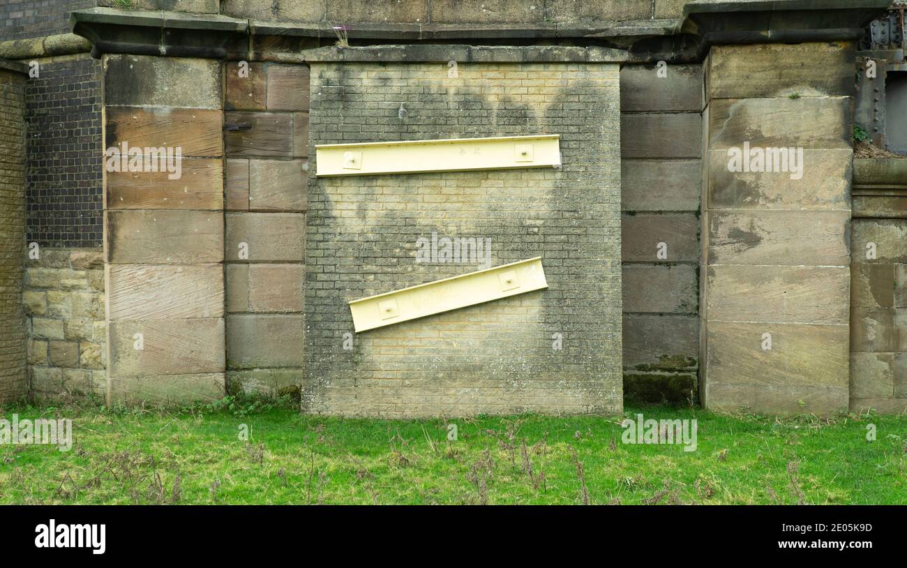 Buttressed wall reinforced with steel bars Stock Photo - Alamy